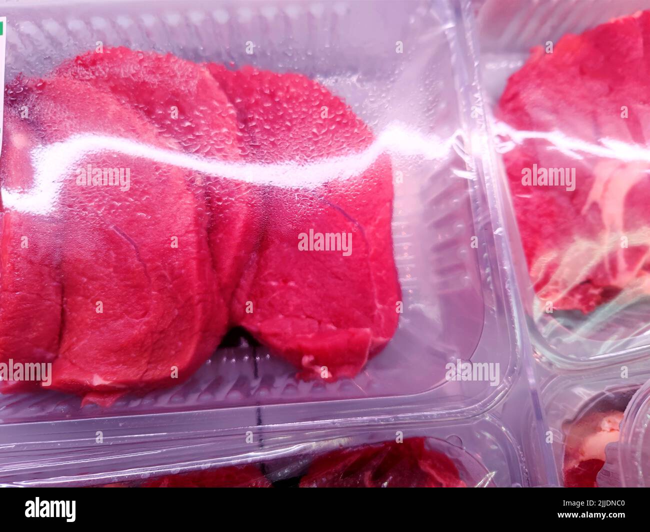 Unbranded beef steaks are on a supermarket shelf ready to be sold Stock ...