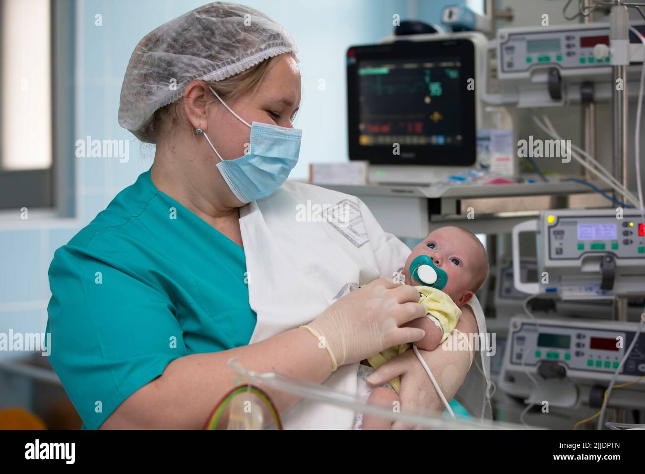 Nurse with a baby in intensive care. Newborn baby in the hospital Stock ...