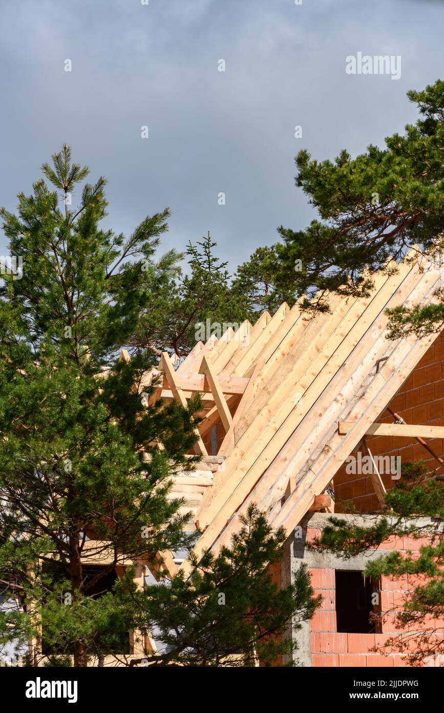 Wooden beams for house roof construction, building a new home Stock ...