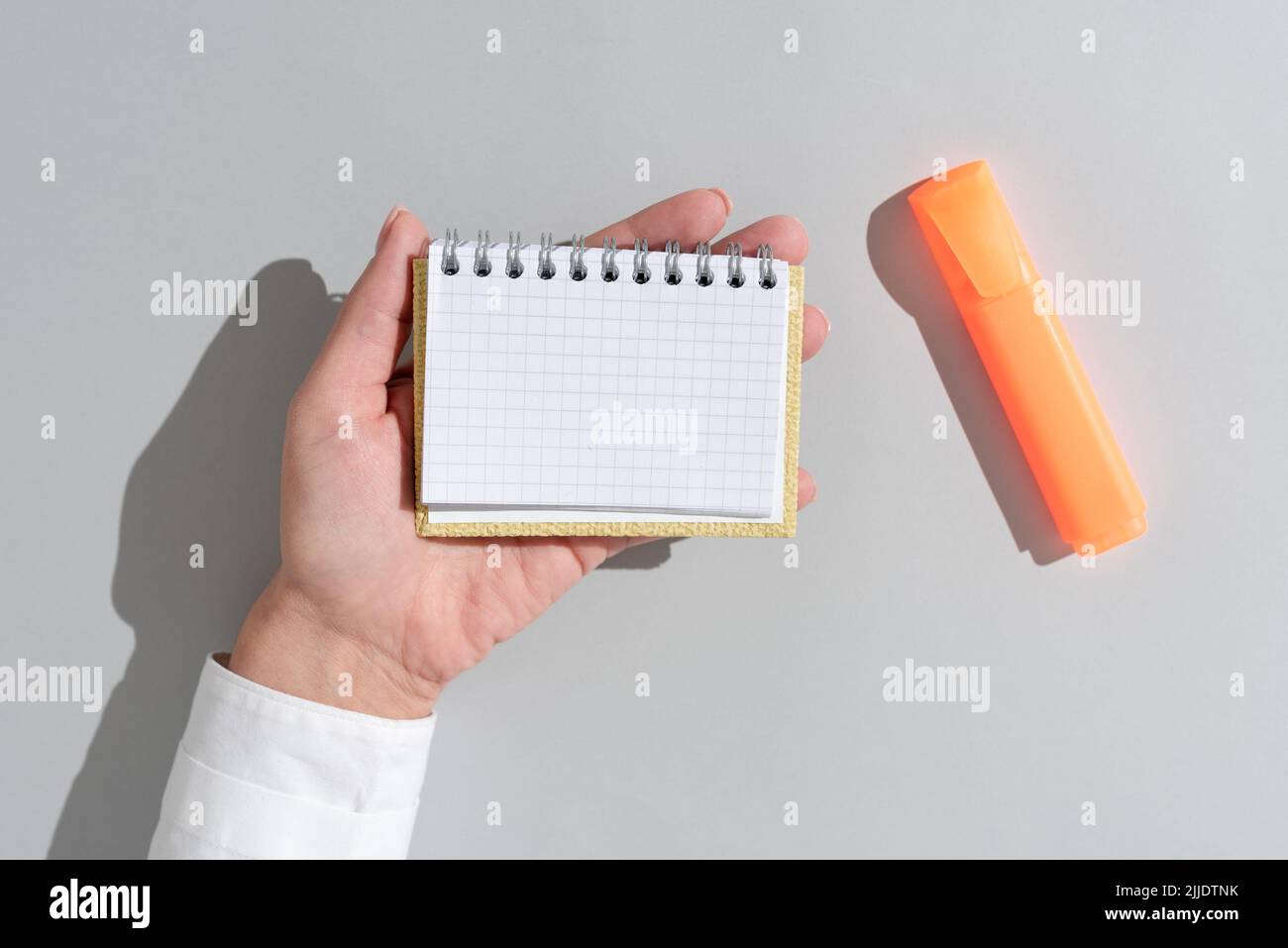 Woman Holding Notepad With Important Message On Office Desk With Marker ...