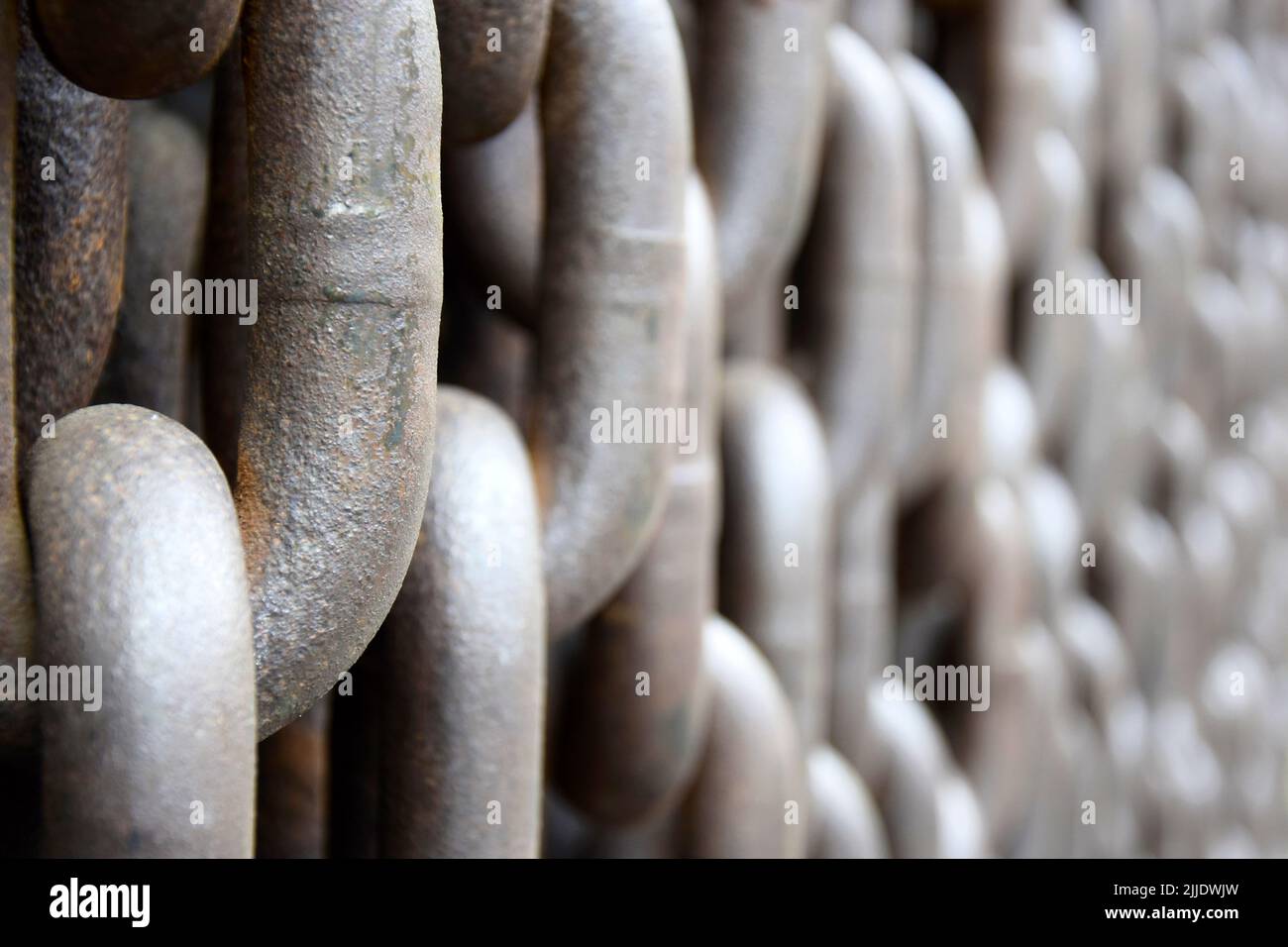Rusty old brown Iron chains, background. Wall of hanging vertically ...