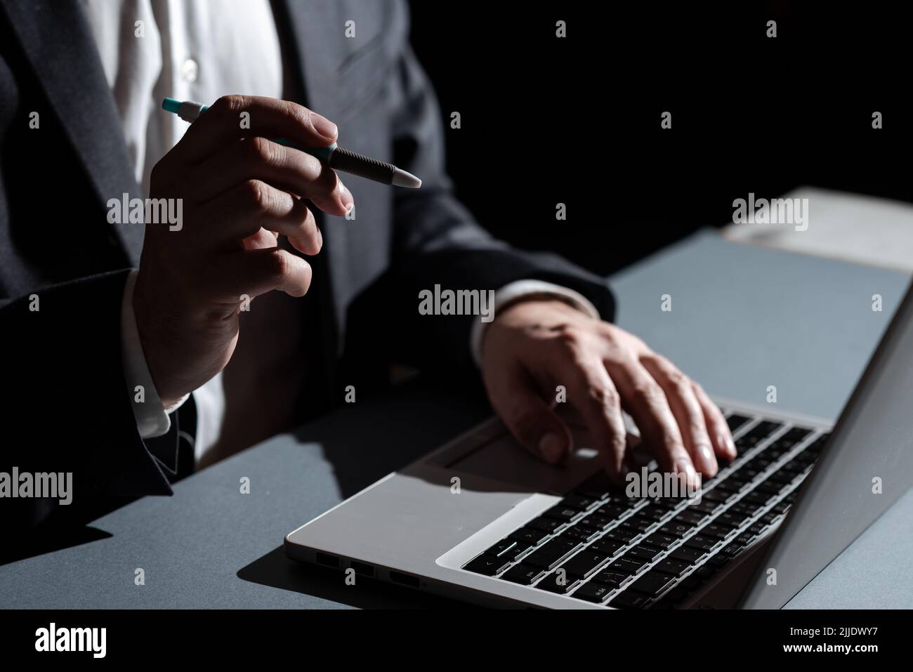 Man Typing Important Data Into Laptop And Pointing New Idea With Pen ...