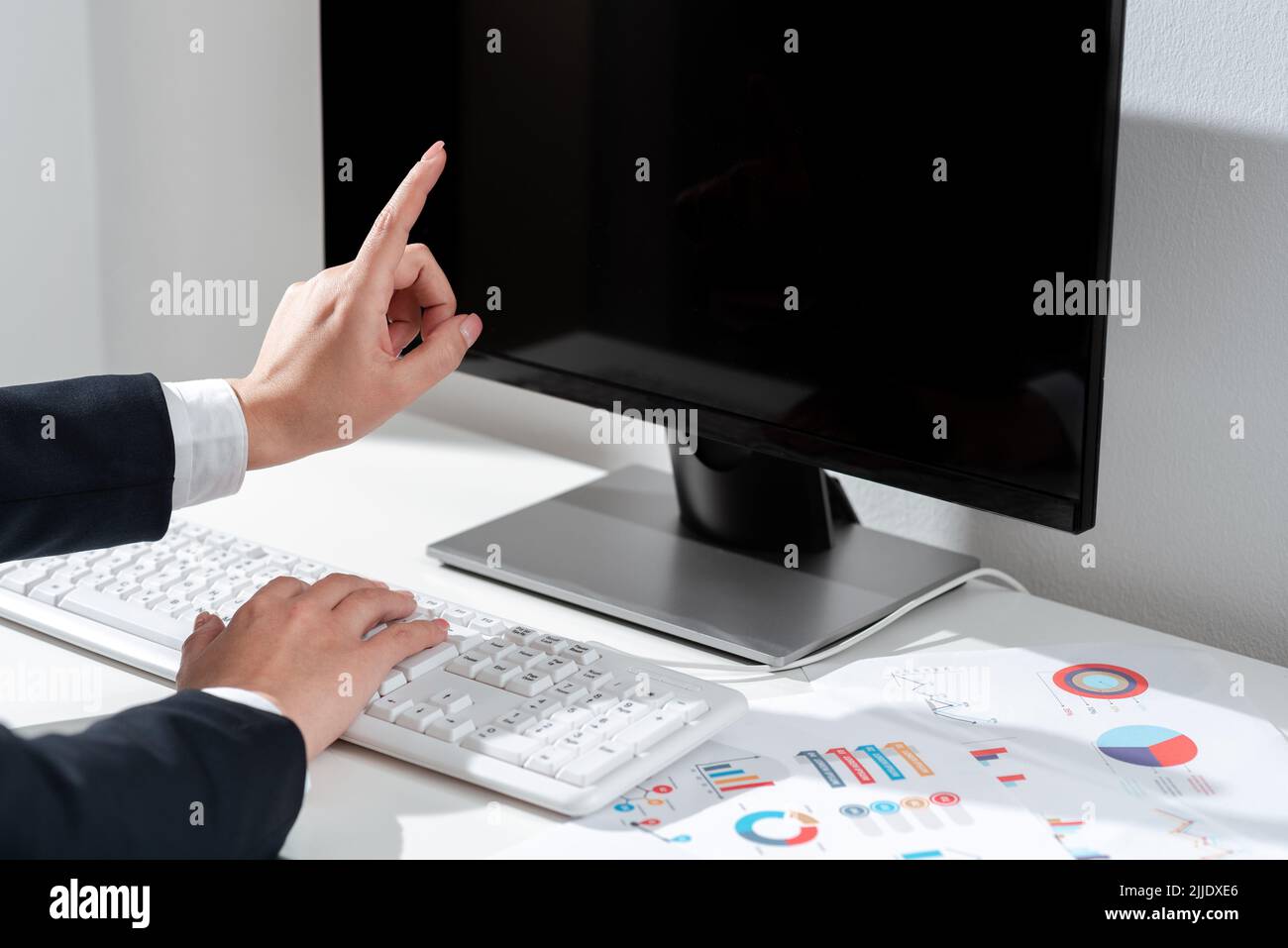 Woman Typing Updates On Lap Top And Pointing New Ideas With One Finger ...