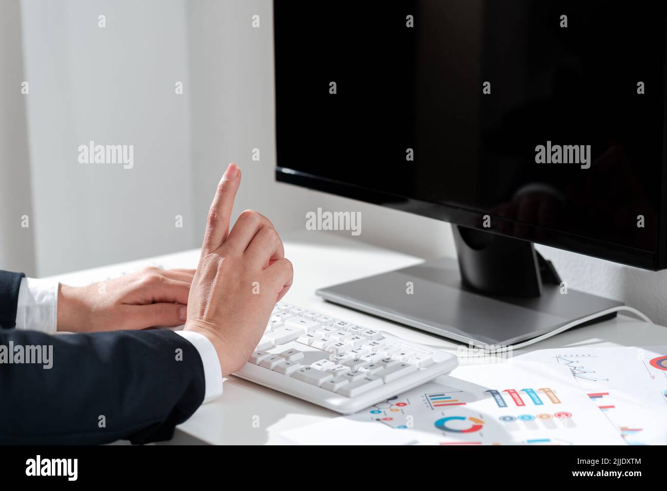 Woman Typing Updates On Lap Top And Pointing New Ideas With One Finger ...