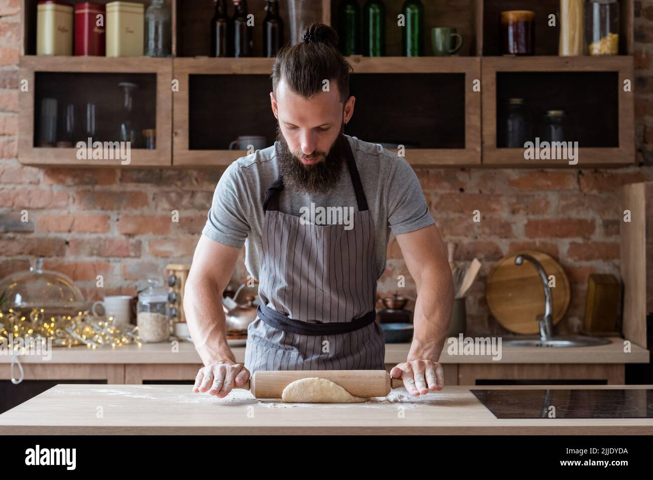 pastry baker food preparing man rolling dough pin Stock Photo - Alamy