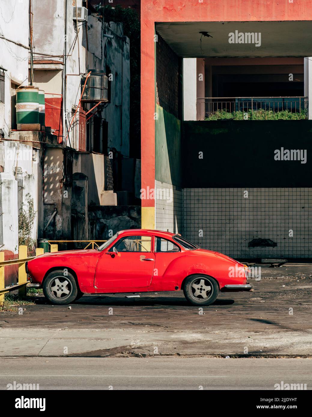 Red car in urban hi-res stock photography and images - Alamy