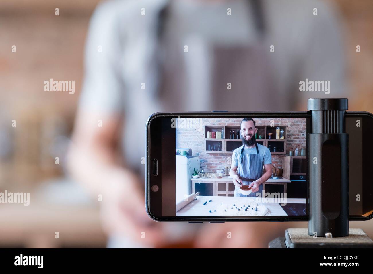 food blogger stream live phone camera man cook Stock Photo - Alamy