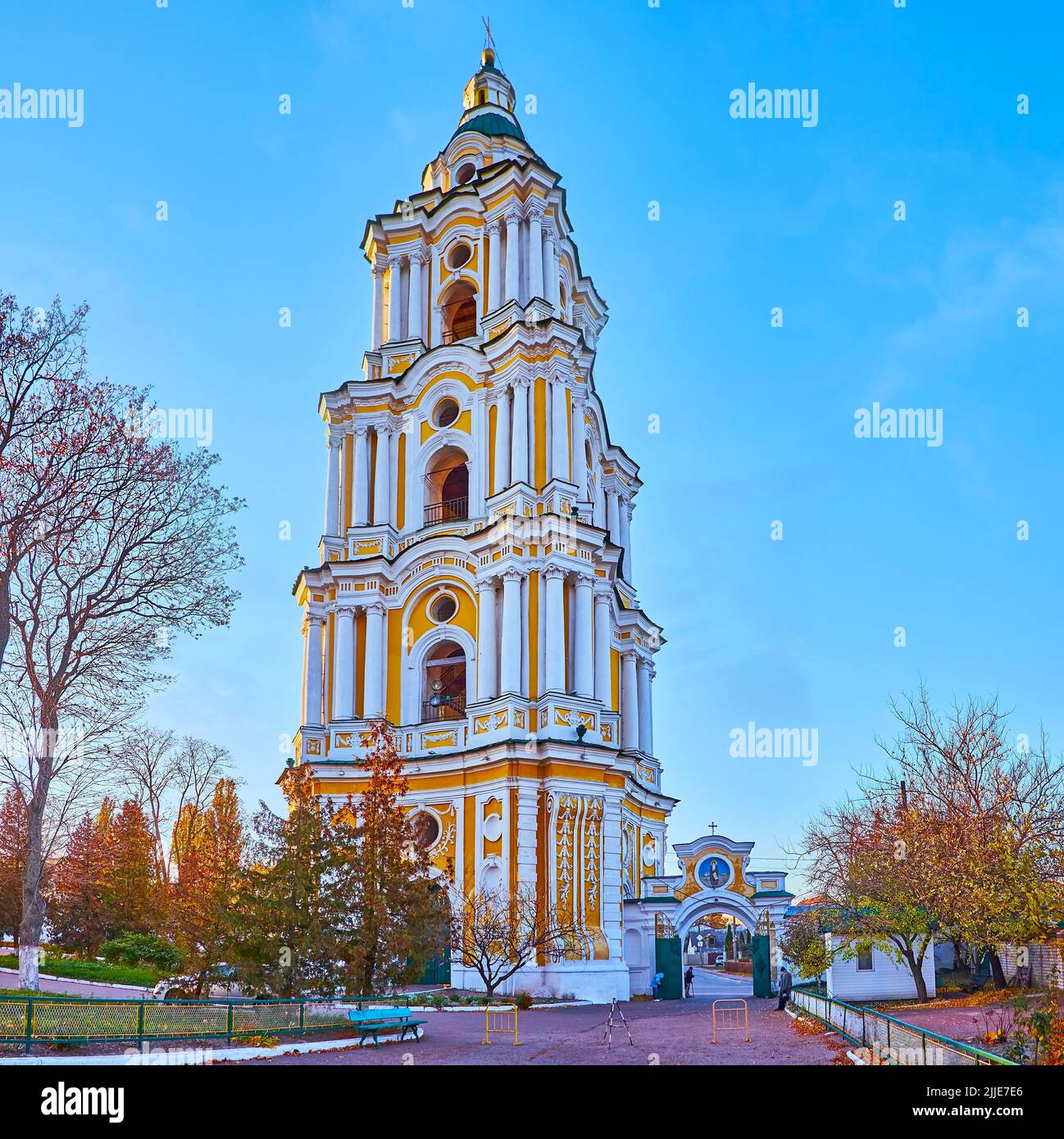 The white-yellow Gate Bell Tower of Trinity-Elias Monastery, decorated ...