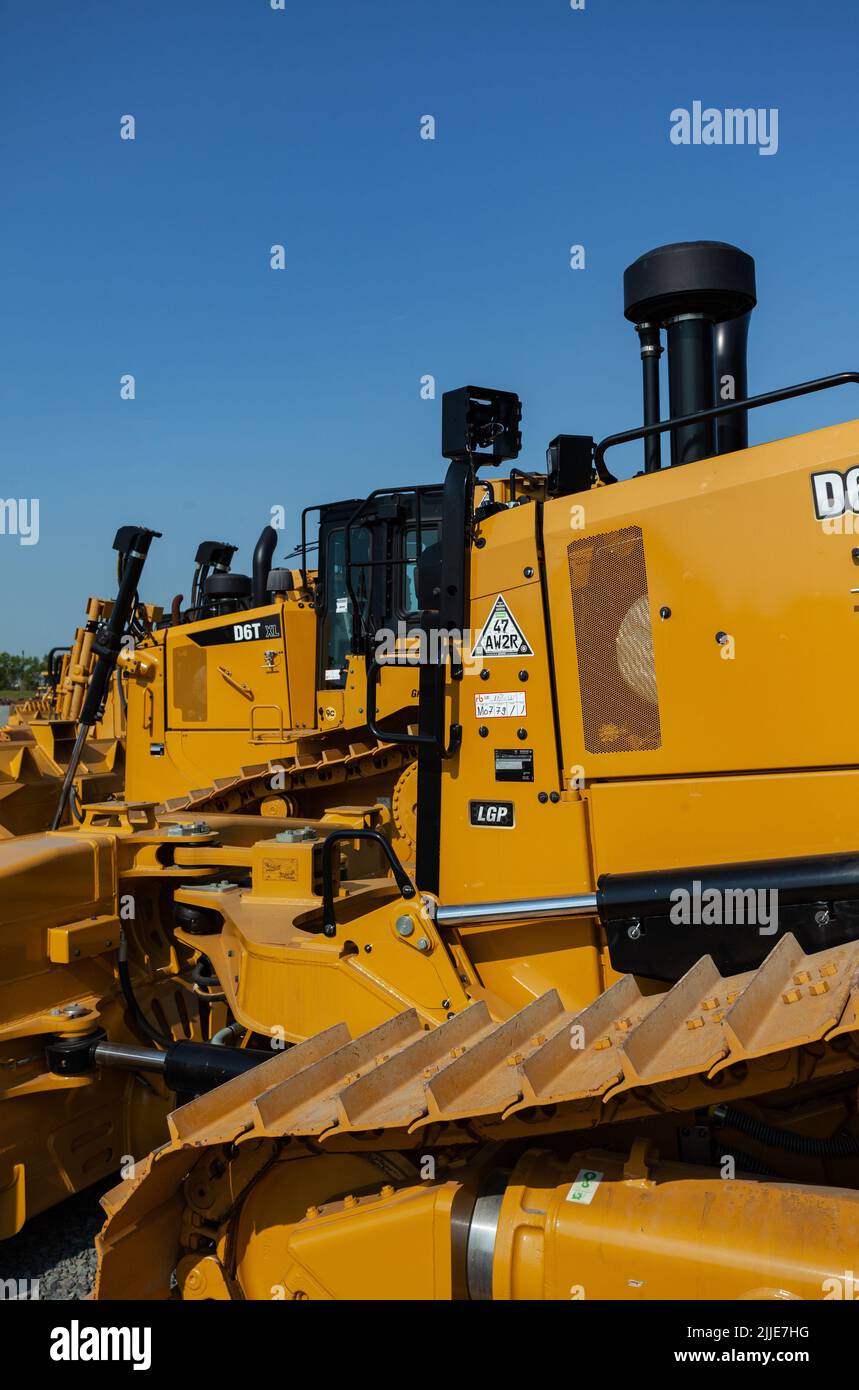 A Close up shot of the track pads and angle cylinders of bulldozers ...