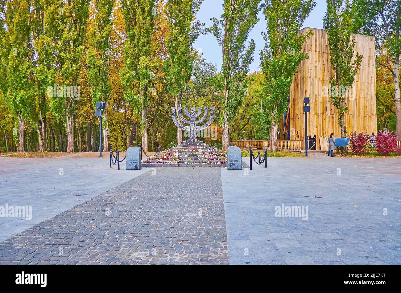 The square with Menorah monument and autumn poplars in background ...
