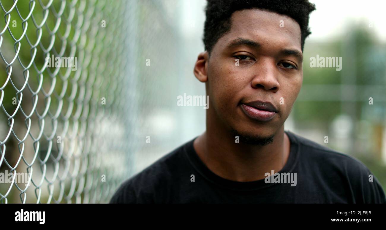 Stressed African man thinking outside. young black guy having doubts ...