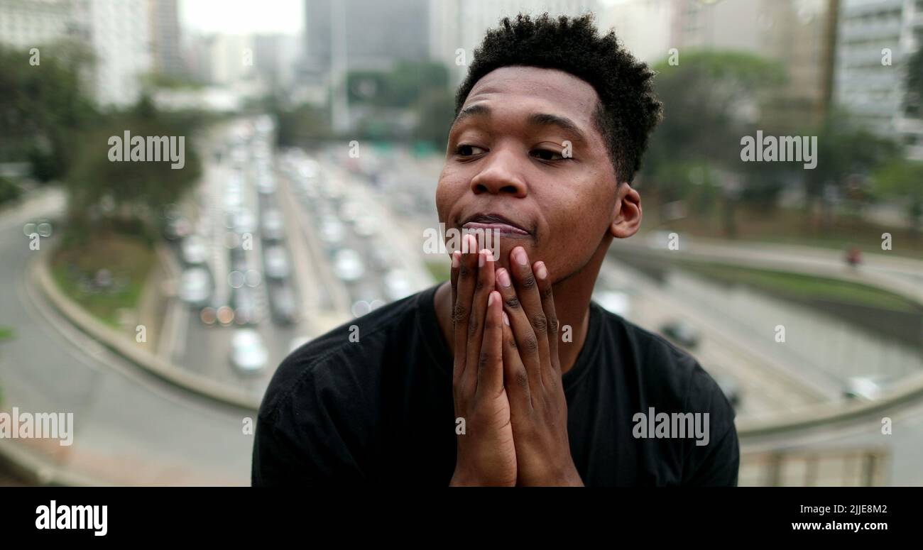 Stressed black African man standing in downtown city feeling anxiety ...