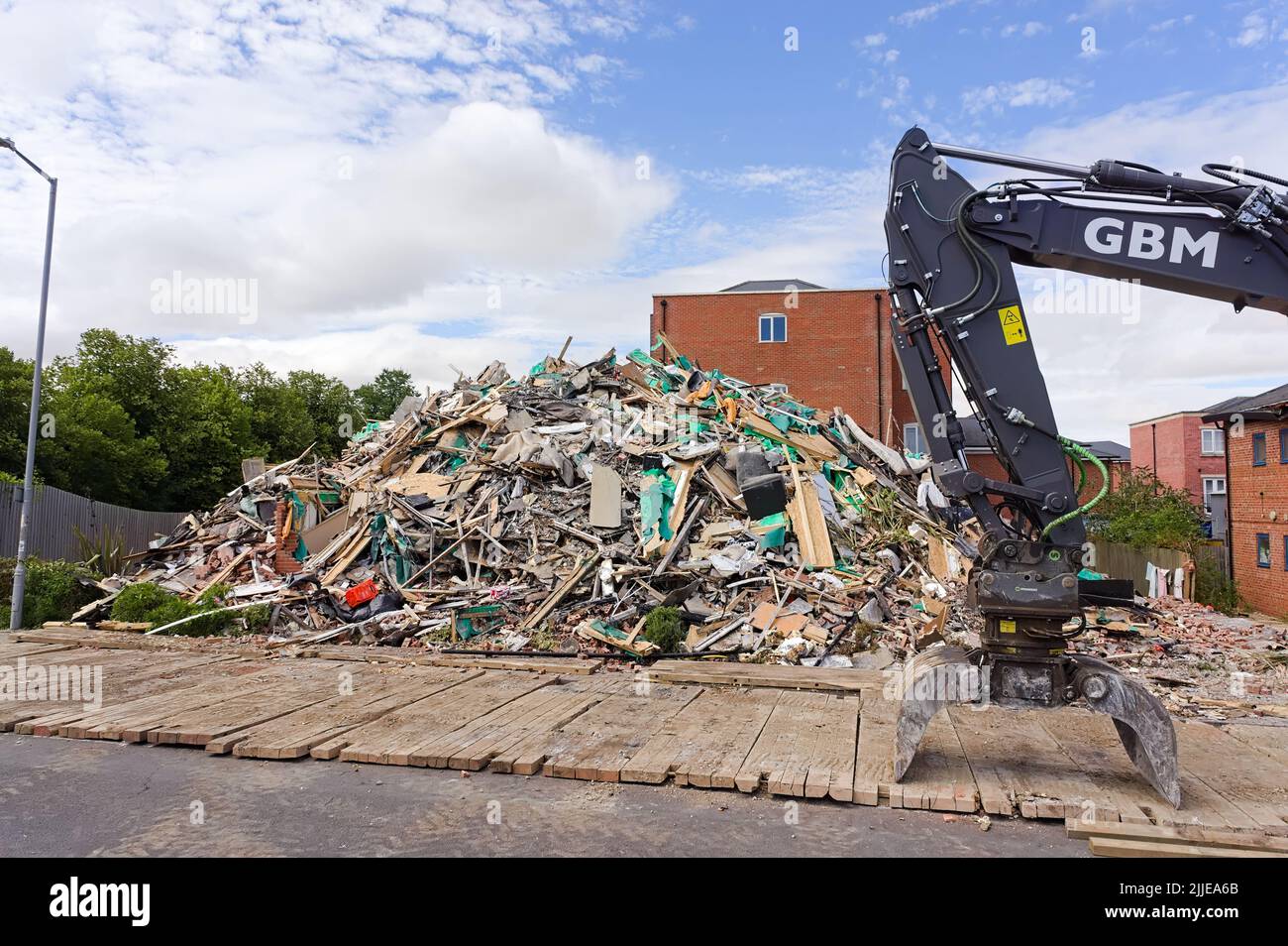 A pile of rubble after demolition of an apartment block due to a fire ...