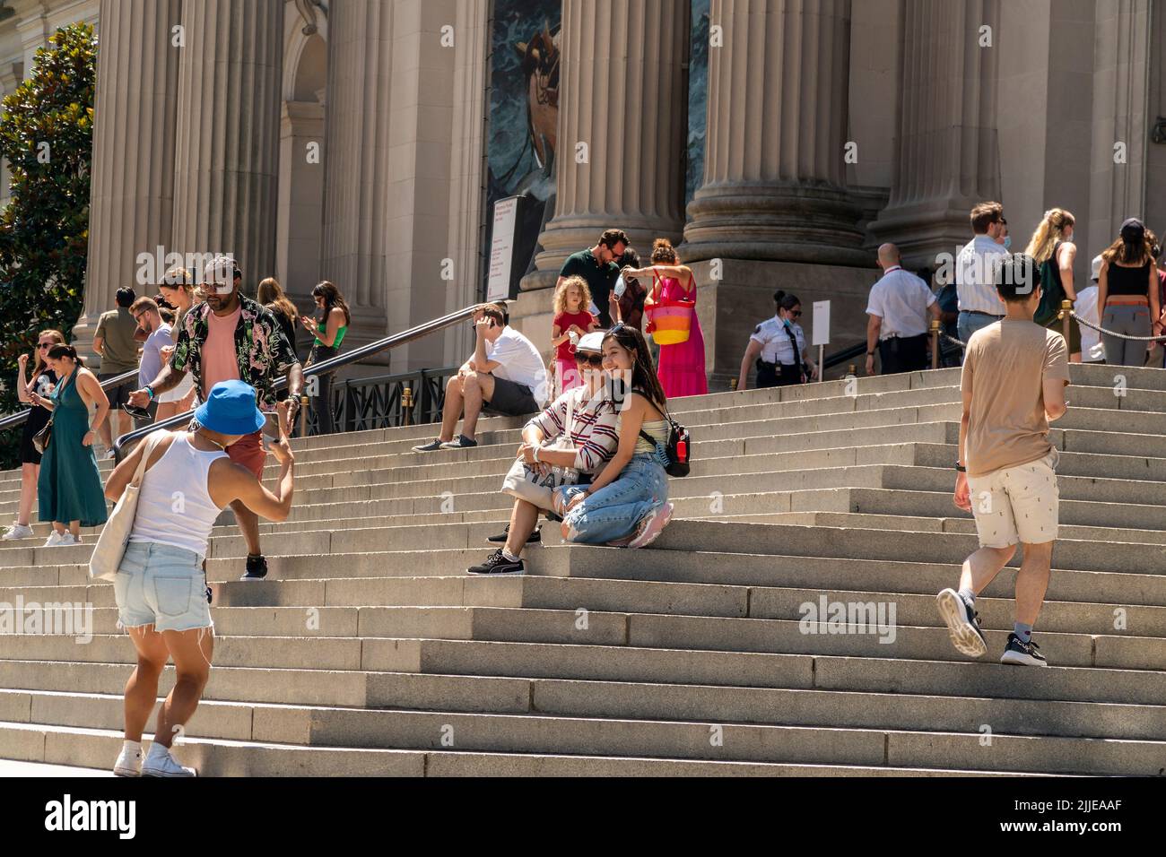 Visitors outside the Metropolitan Museum of Art in New York bake during ...
