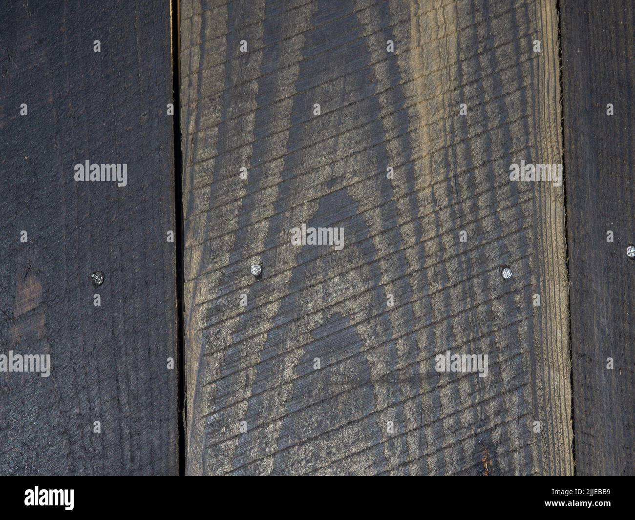 Background from burnt boards. Black wood. Burnt wood wall. Boards after ...