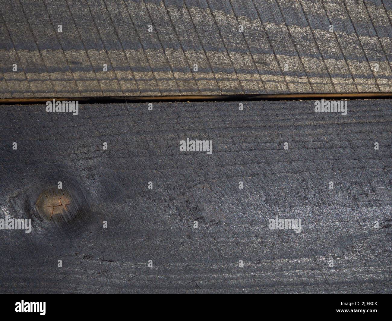 Background from burnt boards. Black wood. Burnt wood wall. Boards after ...