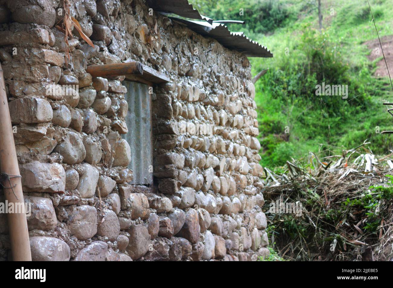 A shot of an old house with a single window Stock Photo - Alamy