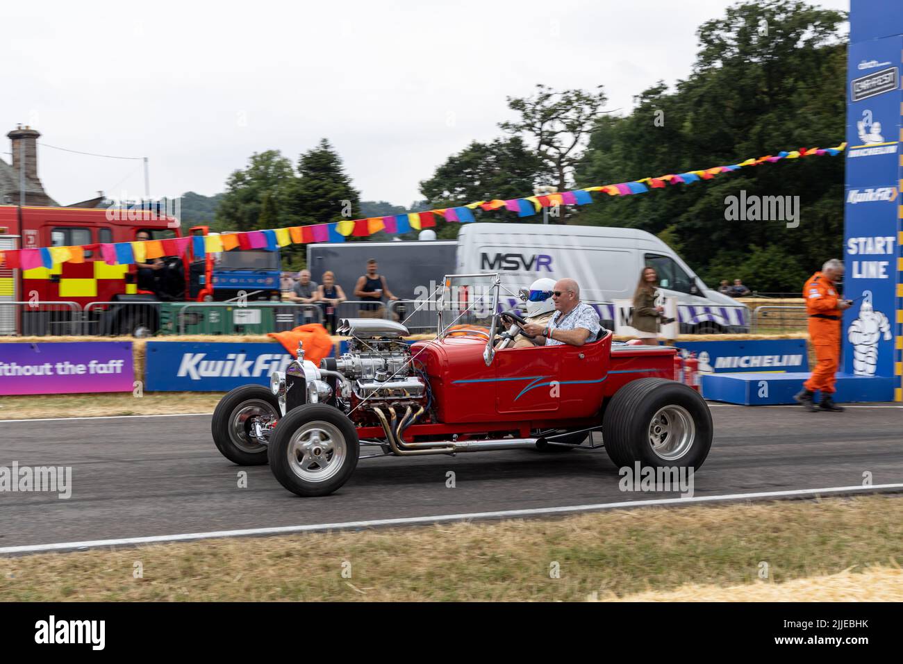 Cars on the track at CarFest Stock Photo - Alamy