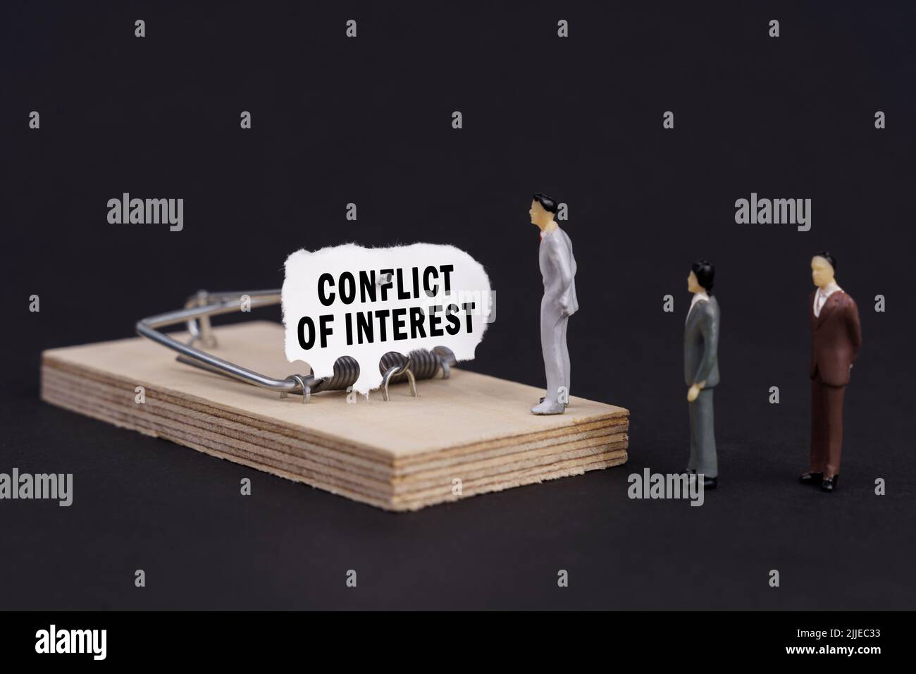 Business trap, crisis concept. Figures of businessmen stand near a ...