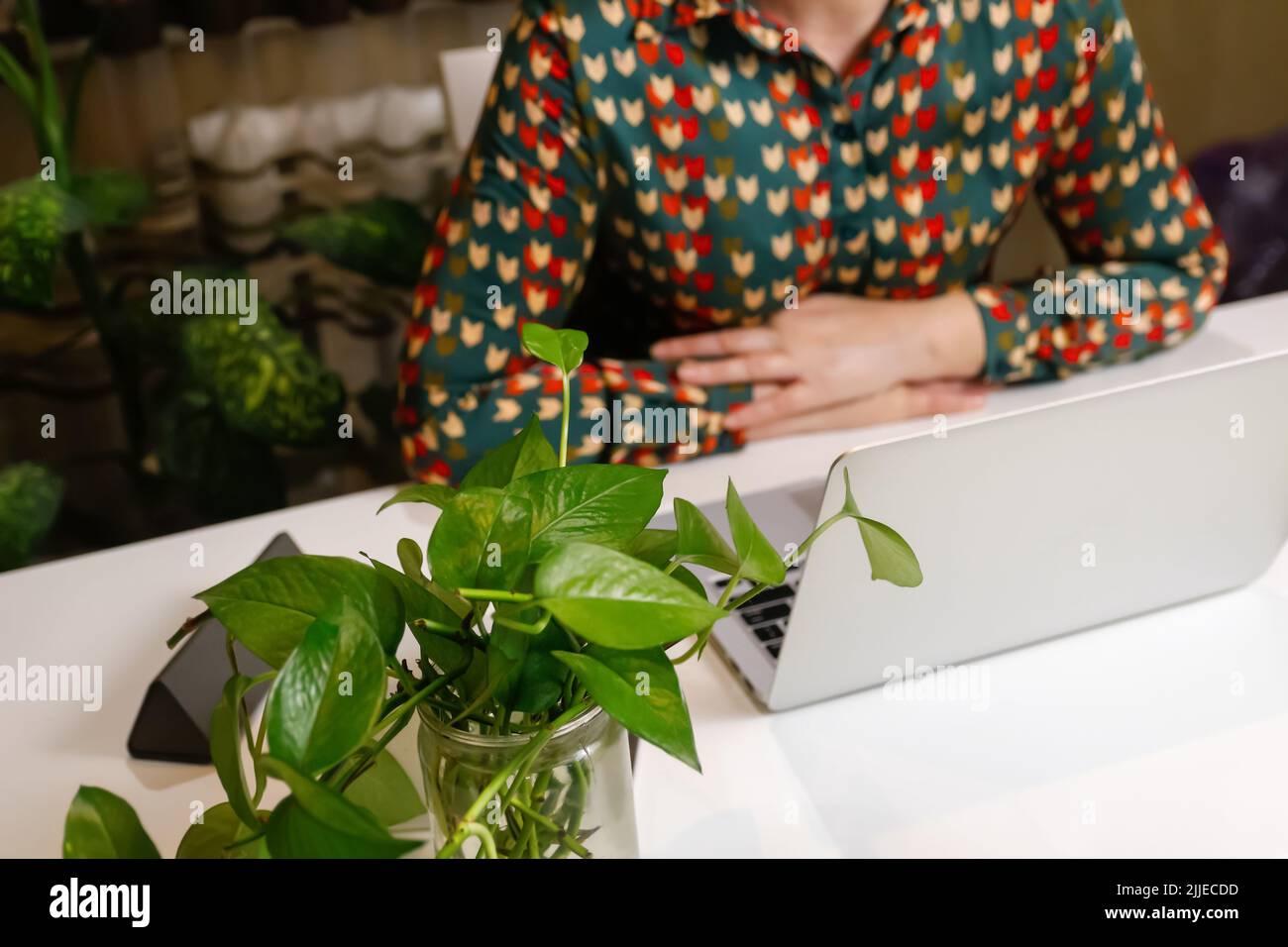 Defocus woman working on computer. Start or finish of a work day. Young ...