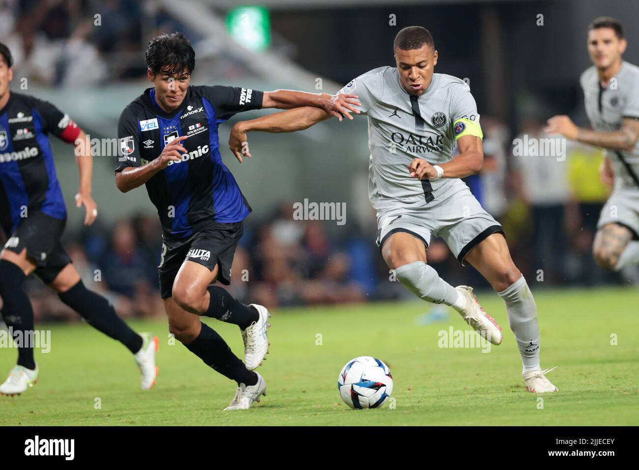 Osaka, Japan. 25th July, 2022. (L-R) Ryu Takao (Gamba), Kylian Mbappe ...