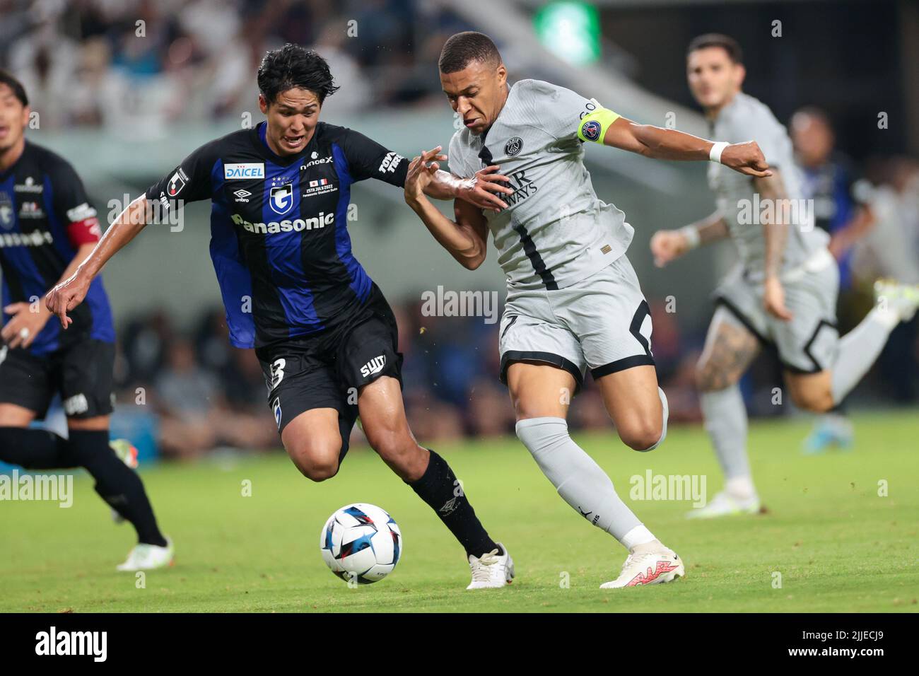 Osaka, Japan. 25th July, 2022. (L-R) Ryu Takao (Gamba), Kylian Mbappe ...
