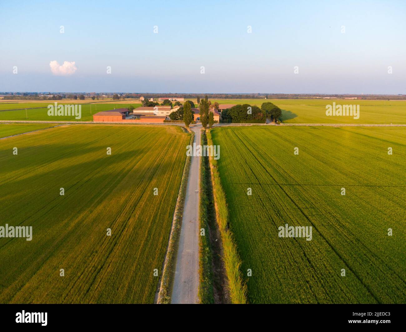 Aerial countryside landscape in Italy with rice fields and an old rural ...