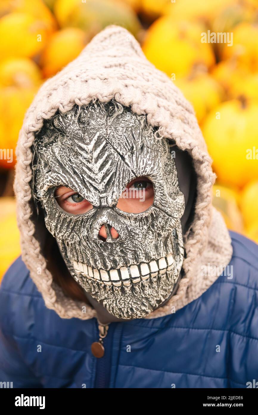 Defocus Halloween people portrait. Person in grim reaper mask standing ...