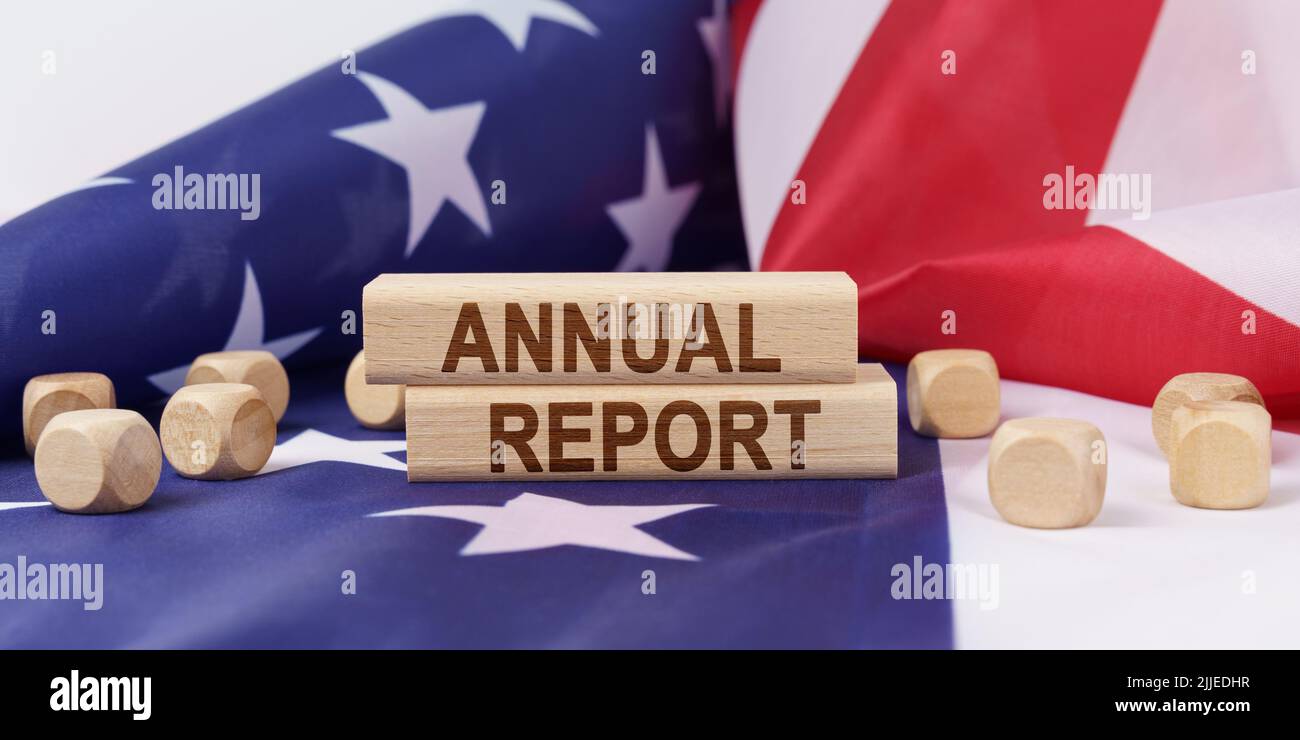 Business concept. The American flag has wooden cubes and plaques that ...