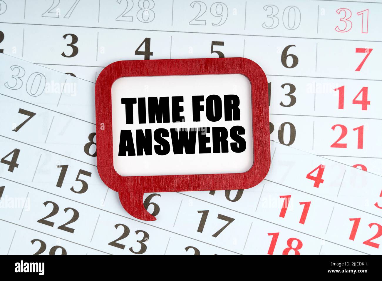 Business concept. On the calendar, a red plaque with the words inside ...