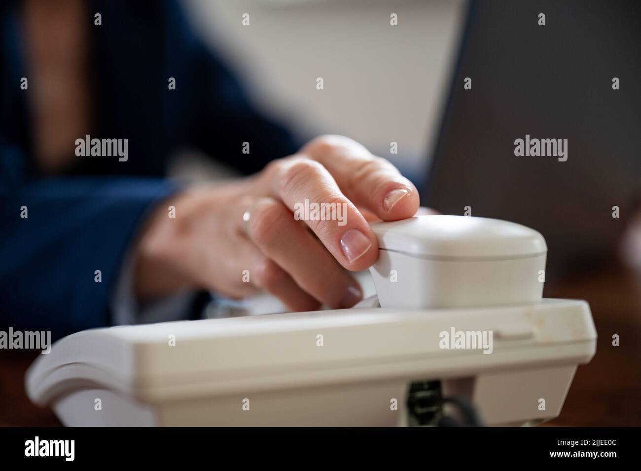 Female hand holding telephone receiver hi-res stock photography and ...