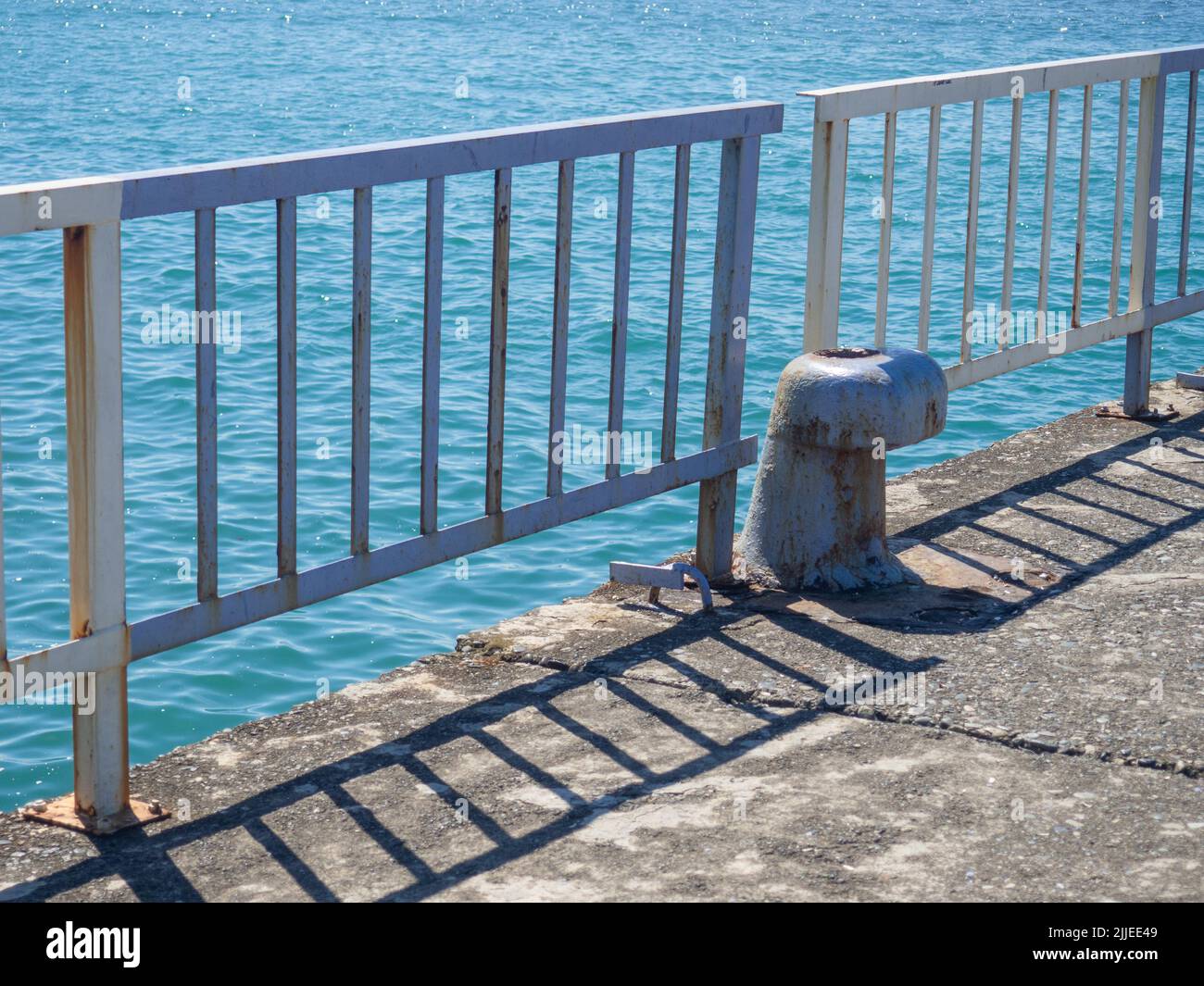 Bollards on the seashore. A place to stop ships. Give mooring line. The ...