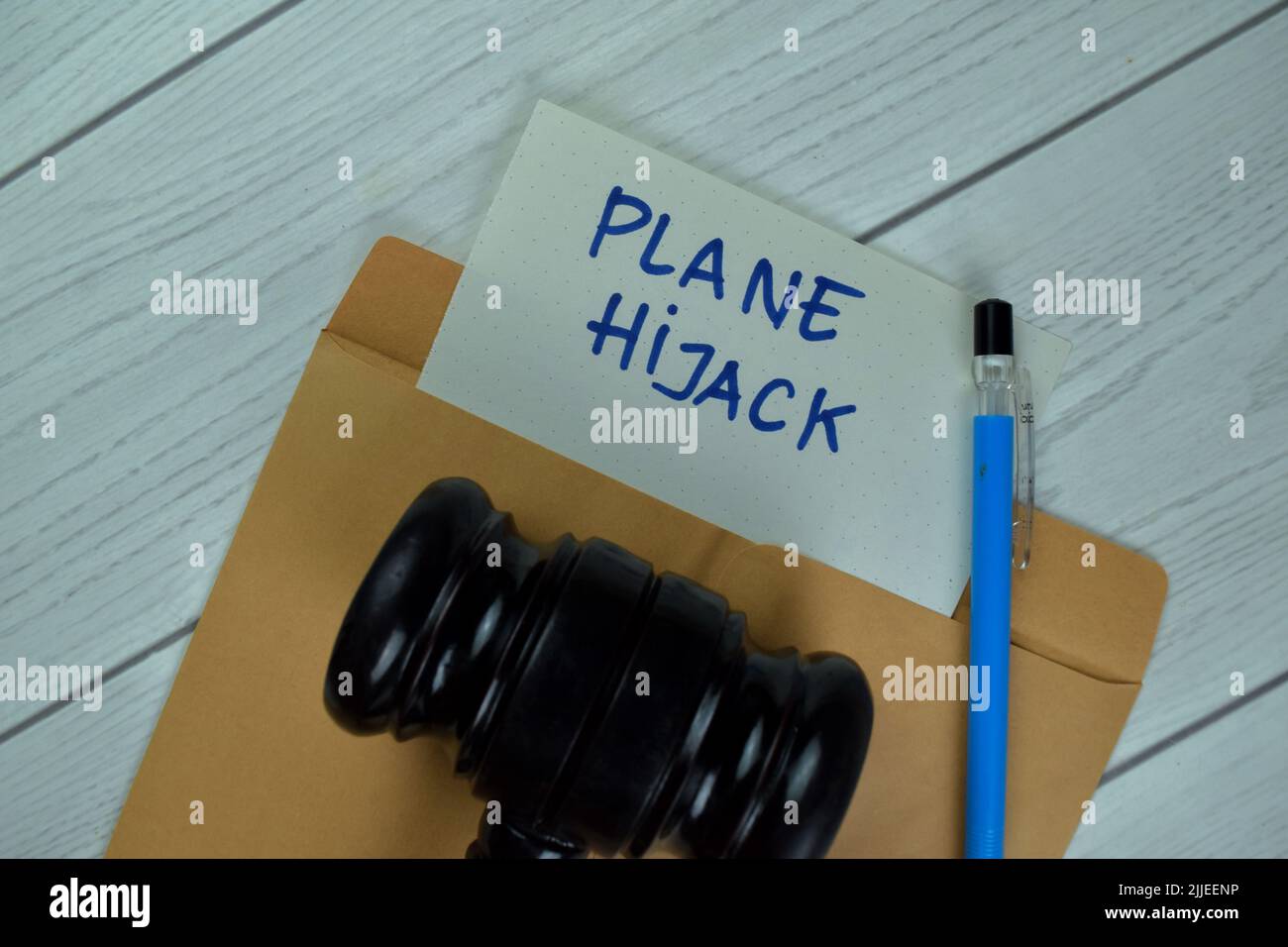 Plane Hijack text on document above brown envelope with gavel Stock ...
