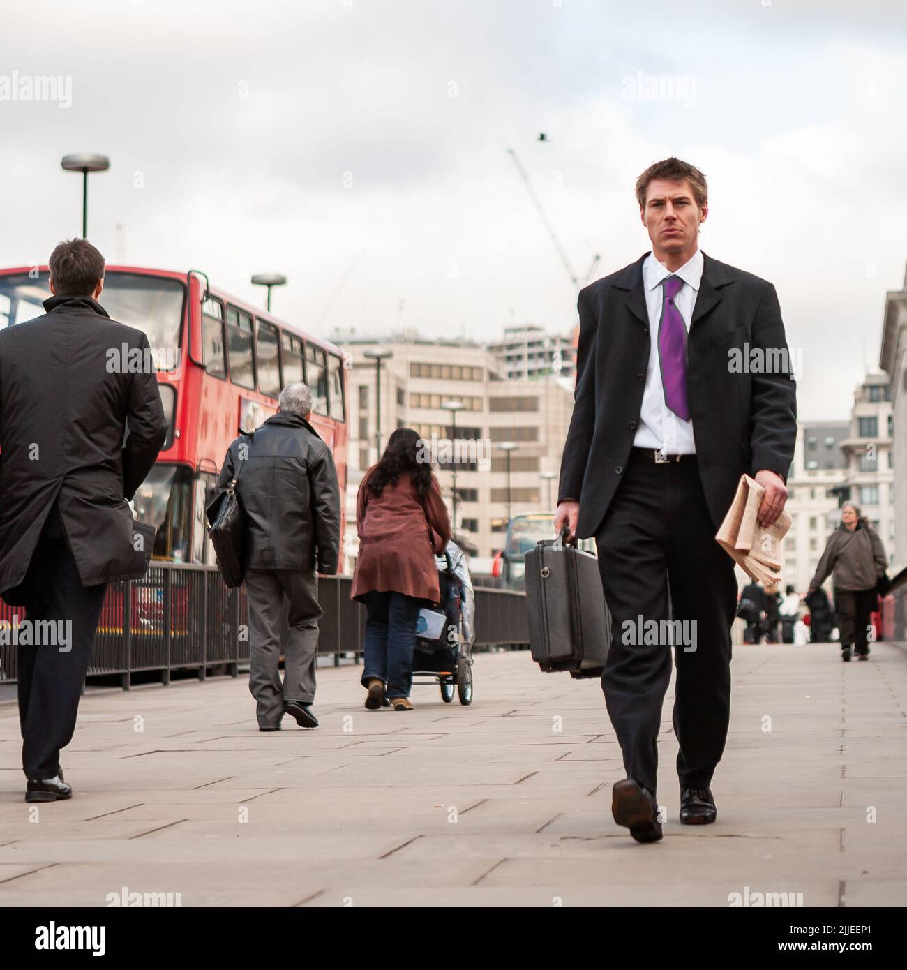 London Bridge commuter. A smart young business professional on his way ...