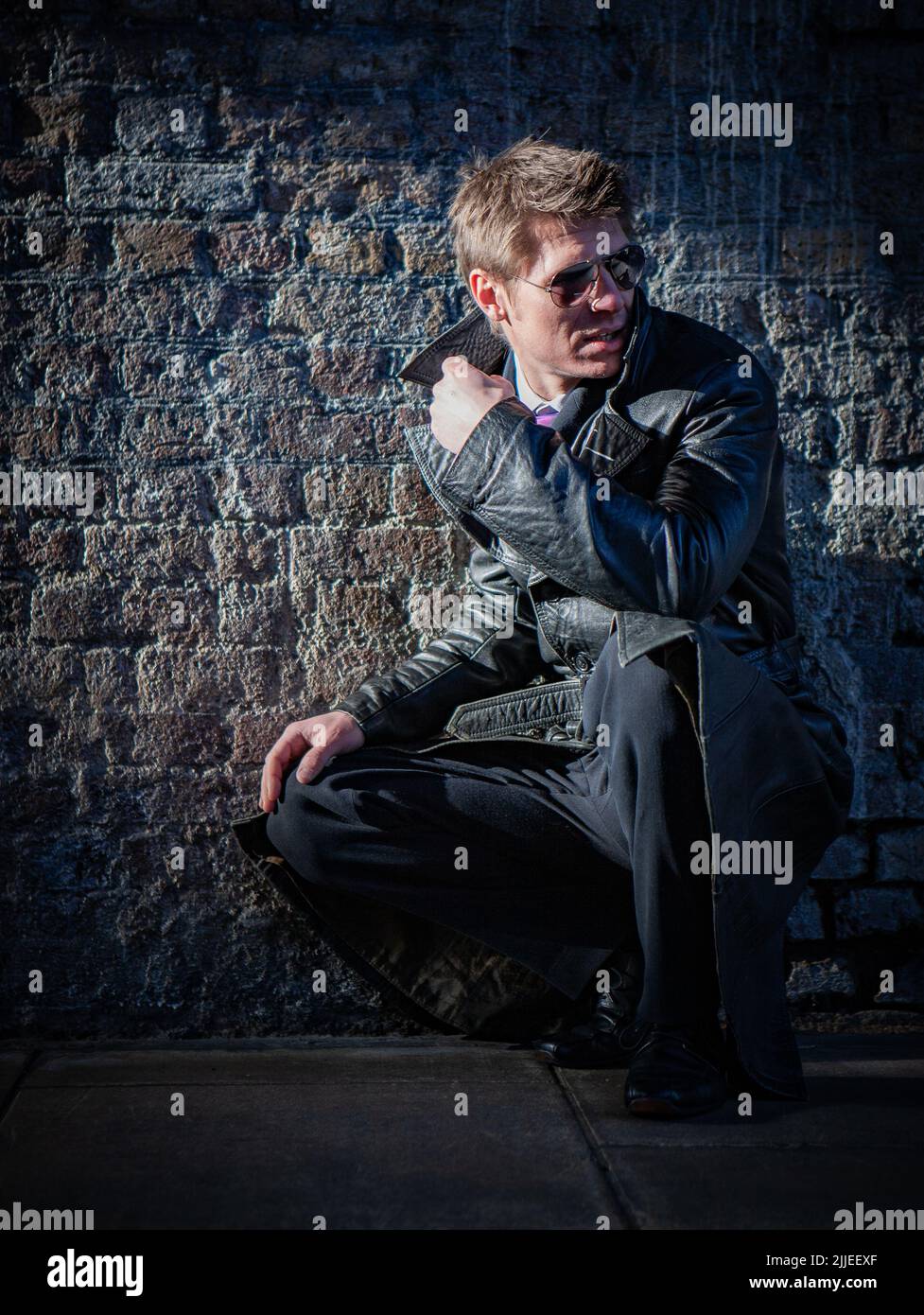 Man hiding shadows hi-res stock photography and images - Alamy