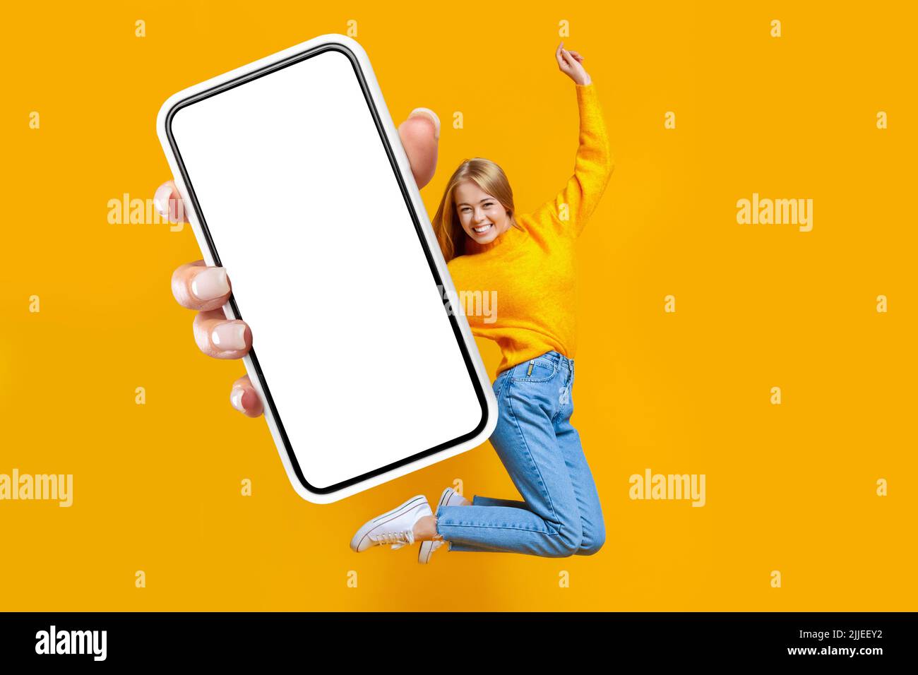 Jumping happy woman cell phone hi-res stock photography and images - Alamy