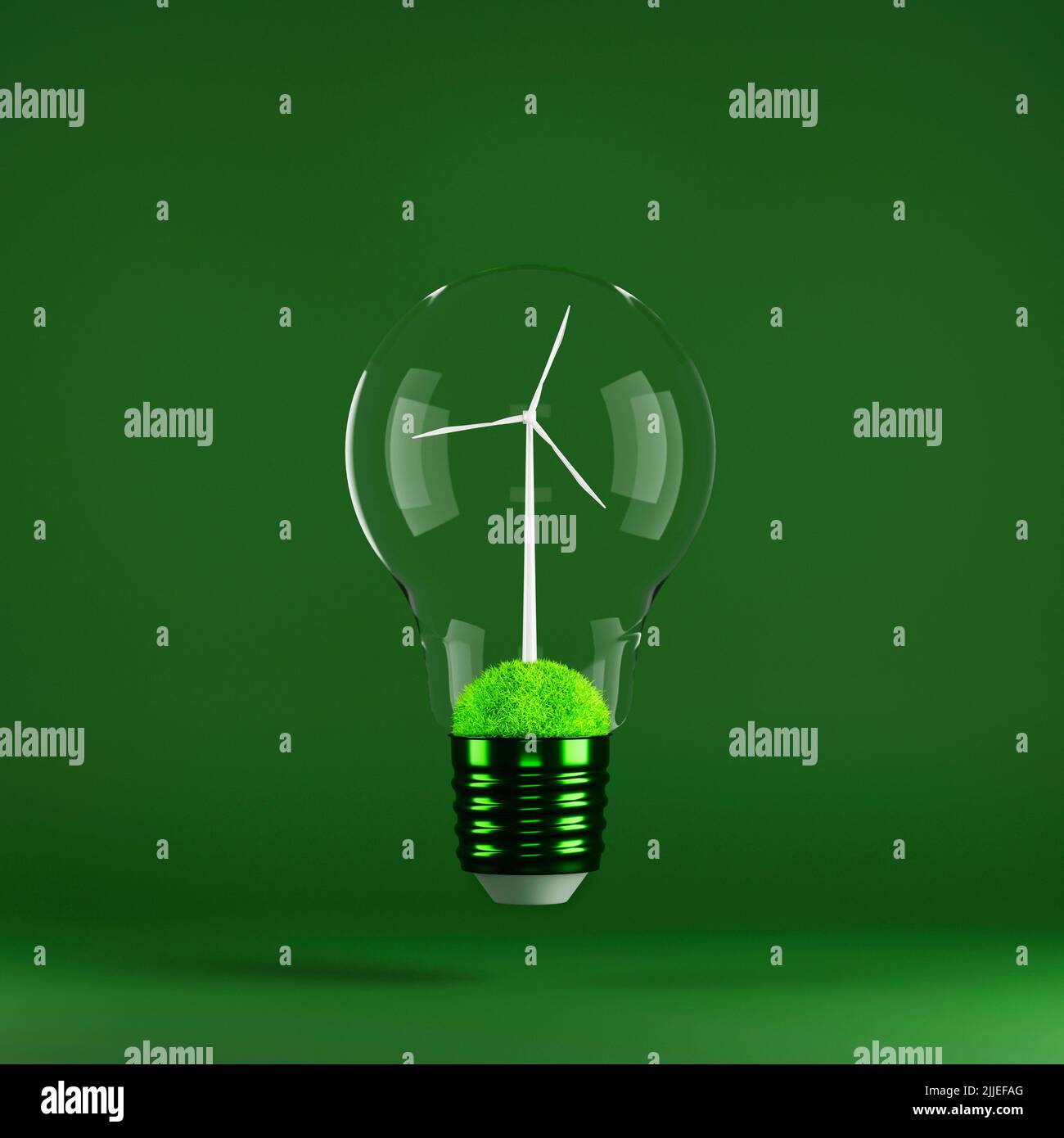 Wind turbine inside light bulb on green background. Concept of energy ...