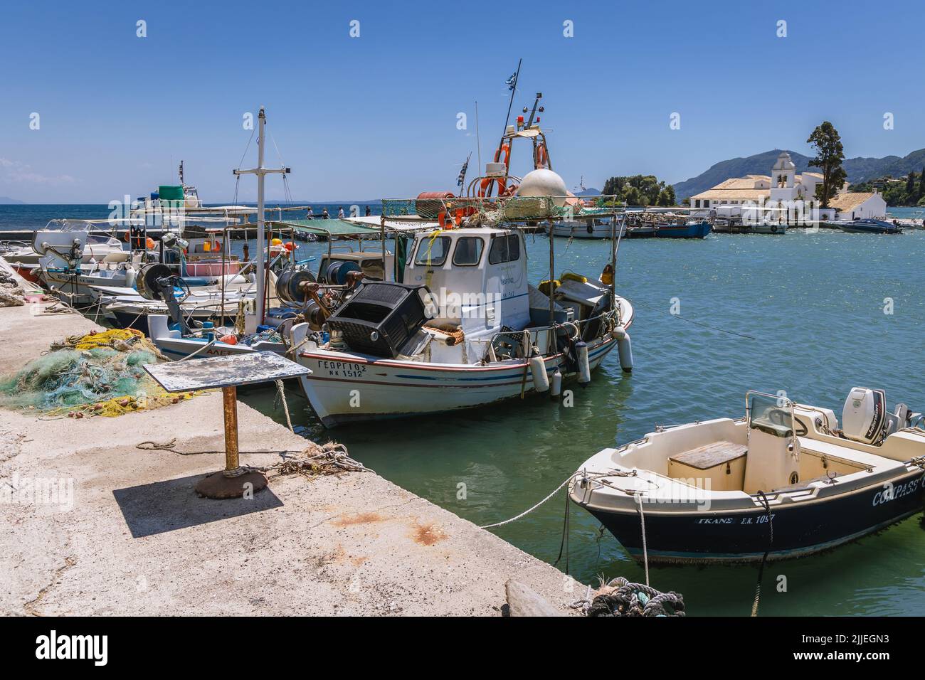 Fishing boats in port in Kanoni area of Corfu city on the island of ...