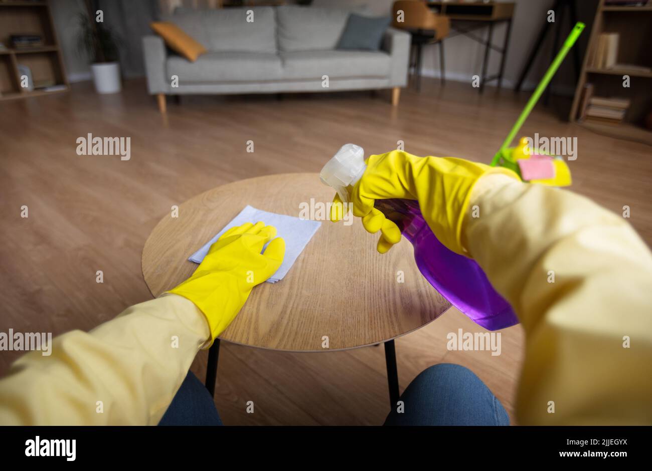 POV Of Woman Cleaning Table With Rag Spraying Detergent Indoors Stock ...