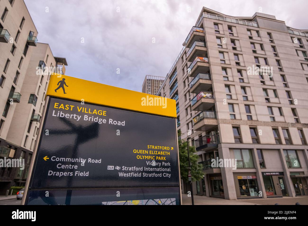 London street sign and flats in the East Village, former Athletes ...