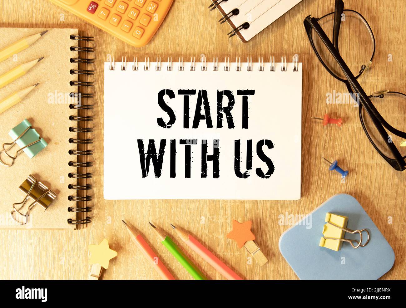 The text Let us get started with red notebook aside isolated on a white ...