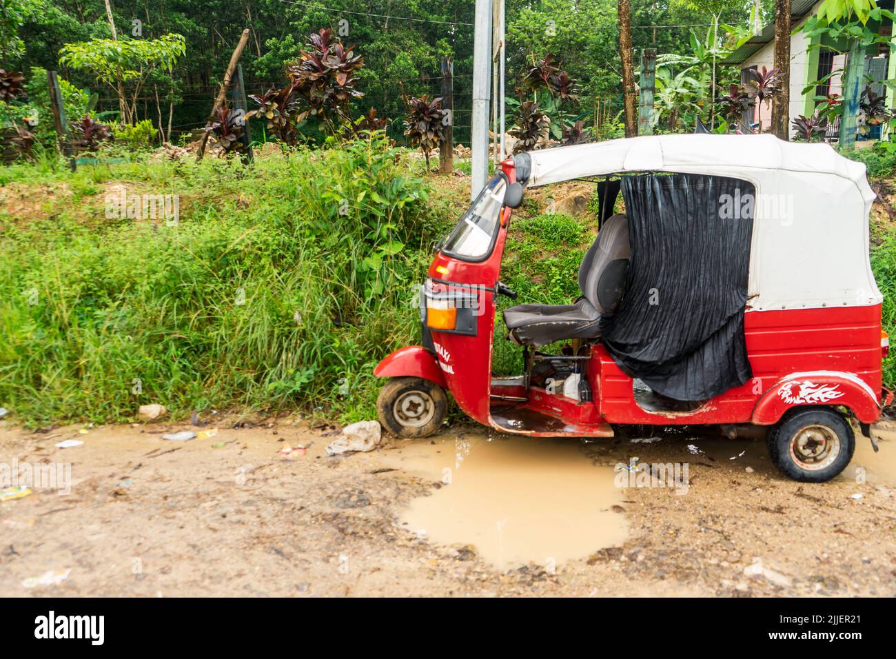 Motorcycle taxi parked on a street in a rural community of El Rama ...