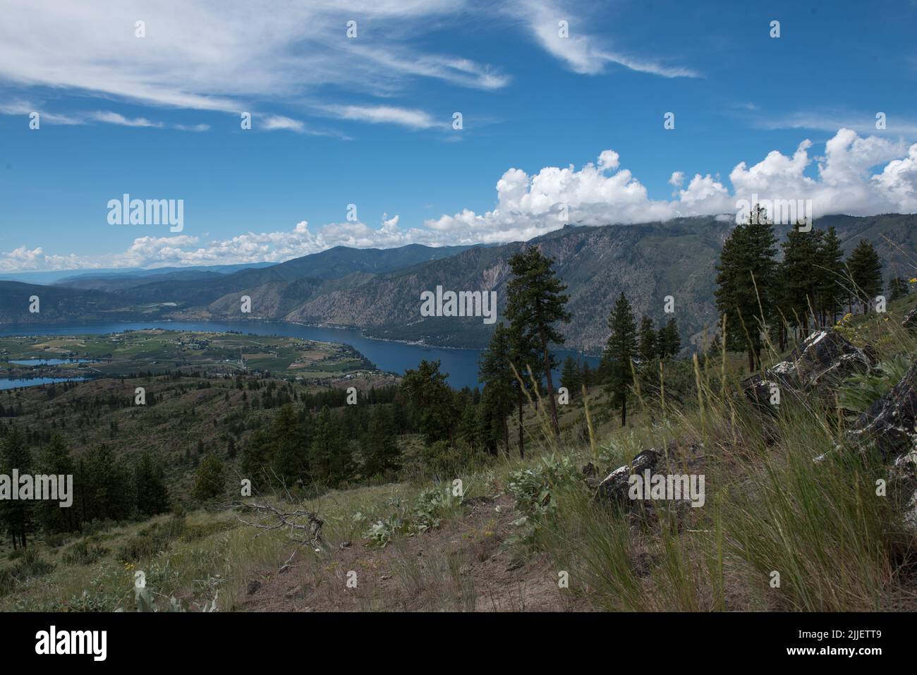 View of Lake Chelan Washington, dark clouds covering mountain top Stock ...