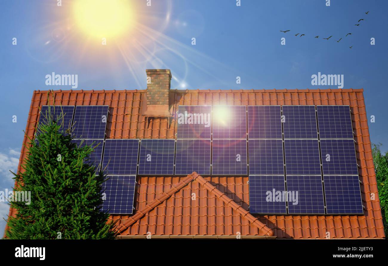 Solar panel on red roof reflecting sun and cloudless blue sky. Roof ...