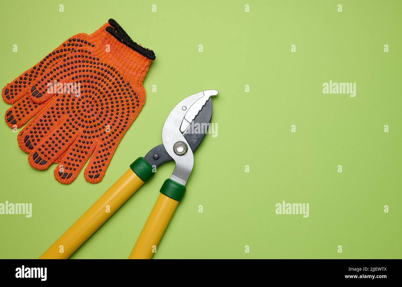 Large garden pruner for pruning branches on trees and orange textile ...