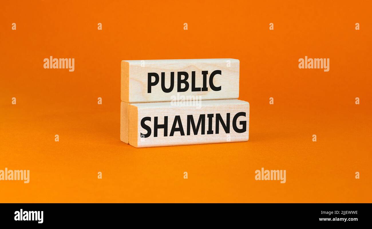 Public shaming symbol. Concept words Public shaming on wooden blocks on ...