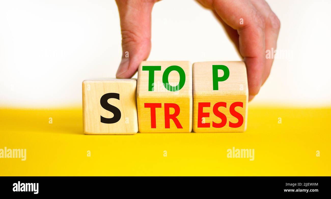 Stop stress and be health symbol. Doctor turns wooden cubes and changes ...