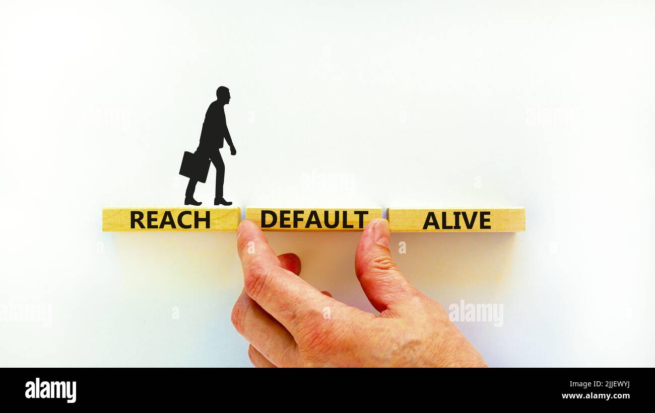 Reach default alive symbol. Concept words Reach default alive on wooden ...