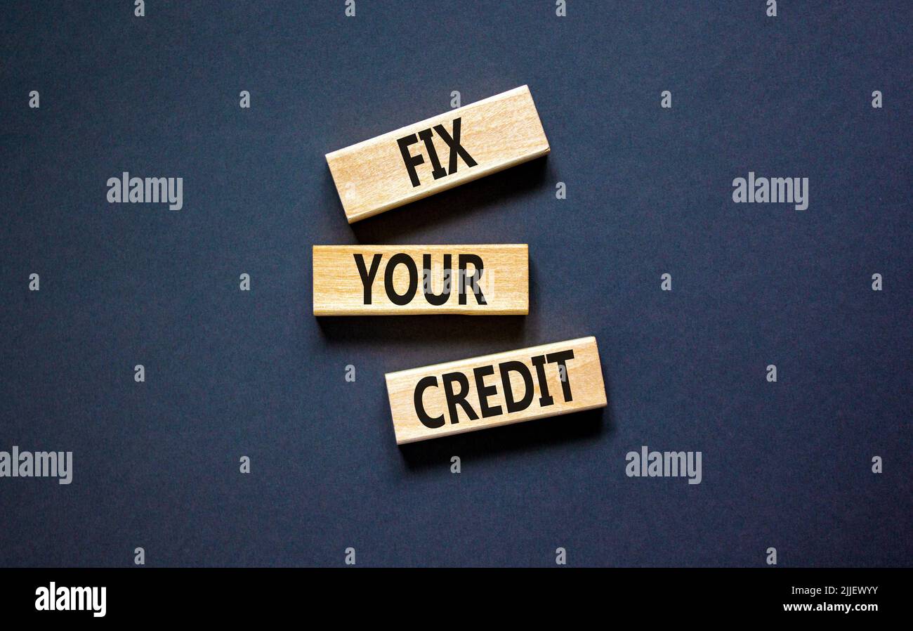 Fix your credit symbol. Concept words Fix your credit on wooden blocks ...