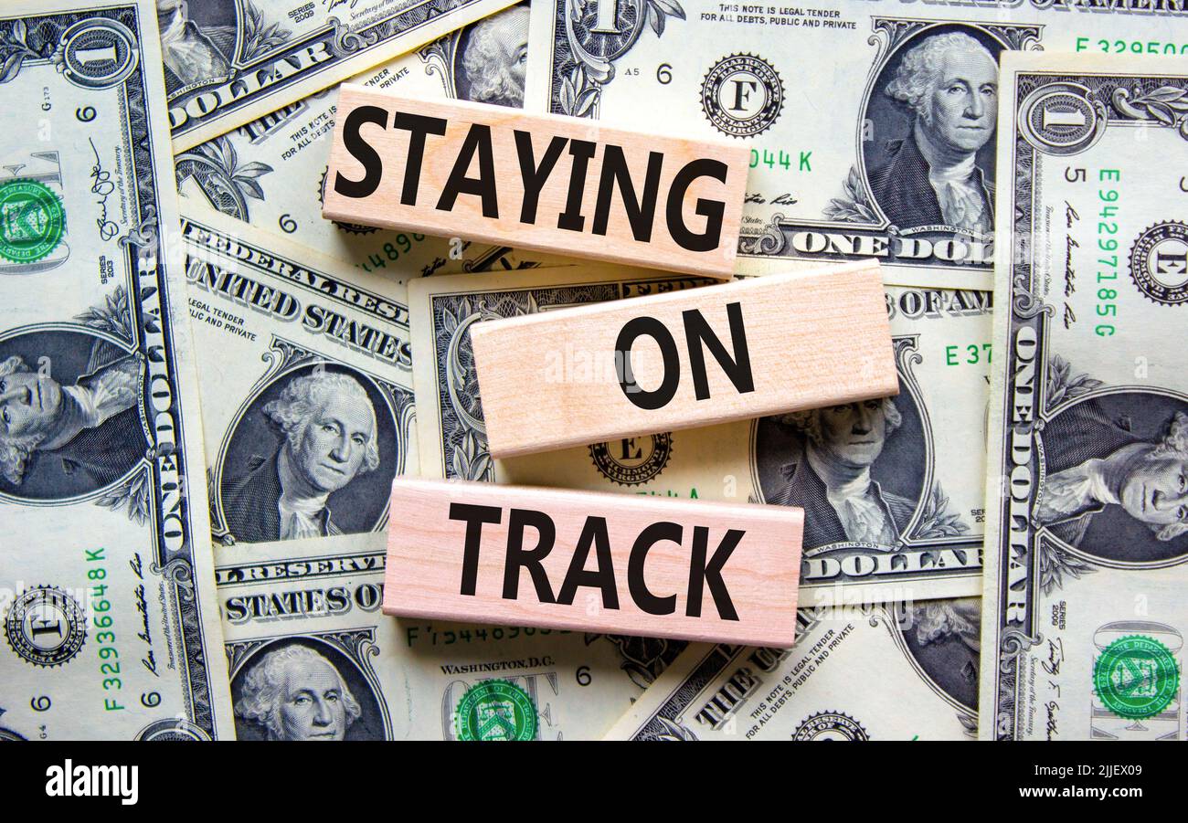 Staying on track symbol. Concept words Staying on track on wooden ...